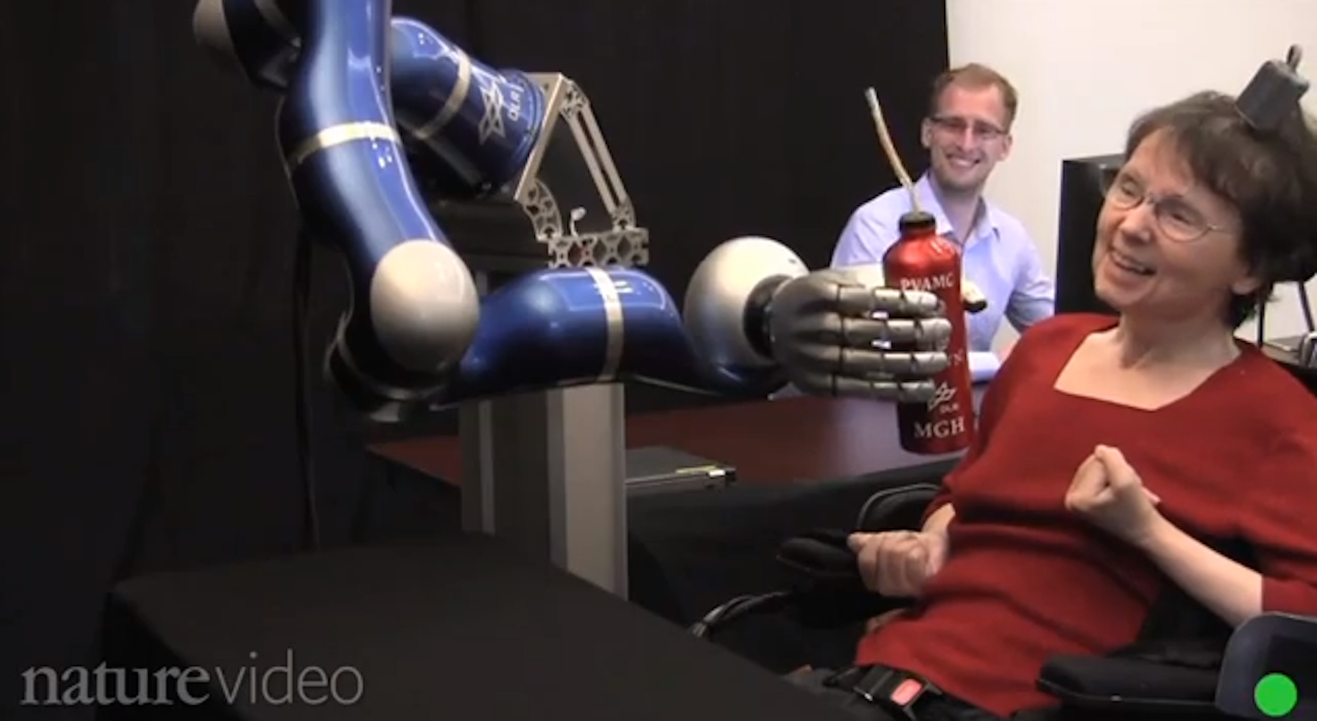 Brain-controlled robotic arm toasts success with a drink