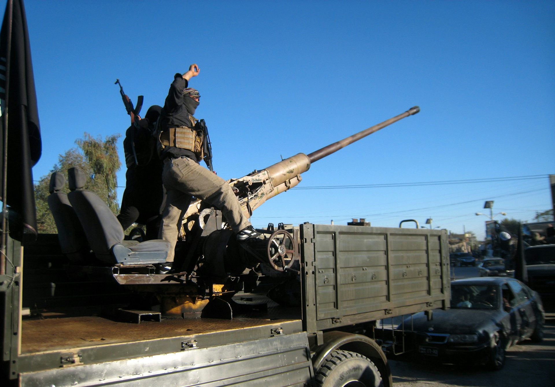 IS sweeps across borders and takes grip of an Iraq collapsing back into ...