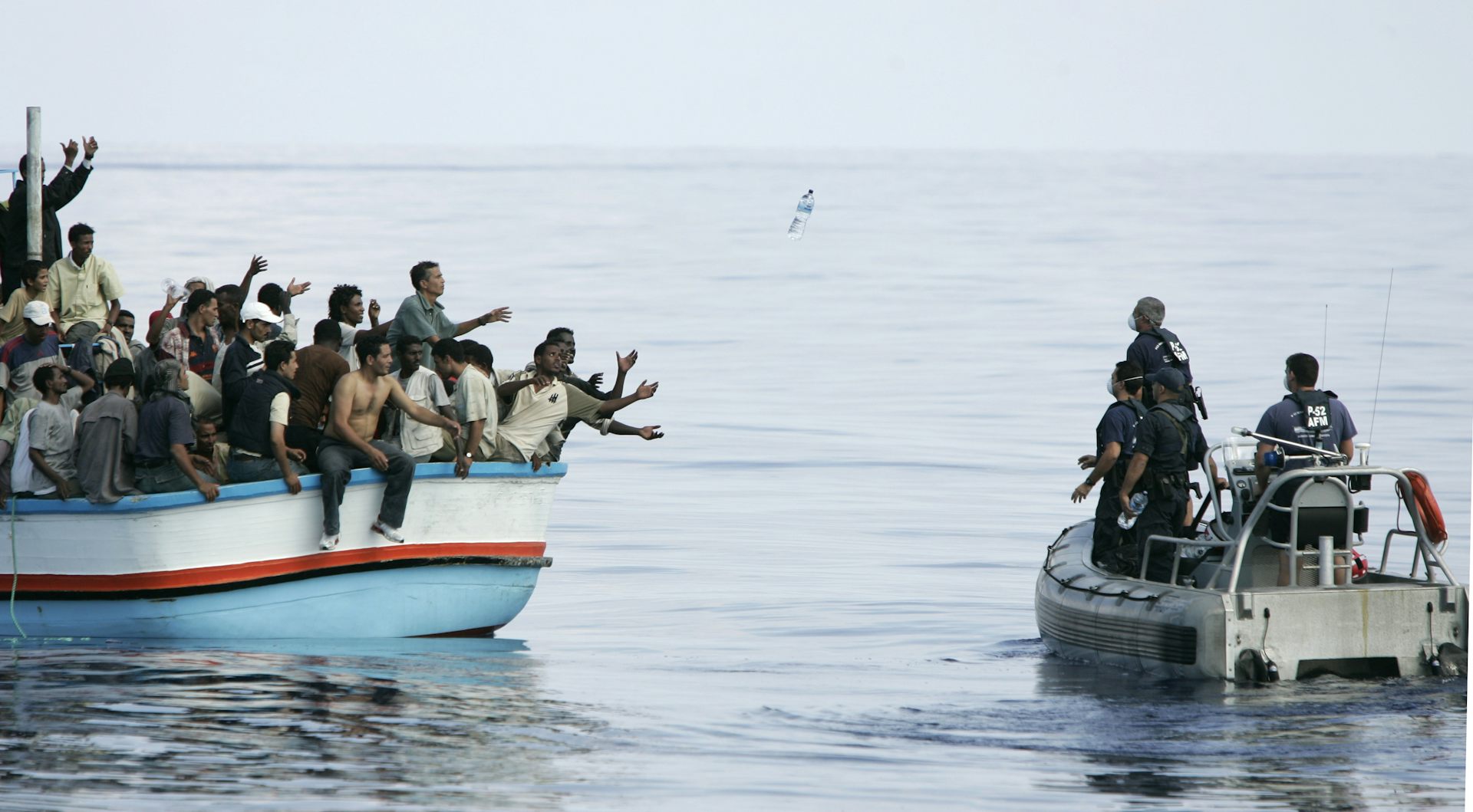 Migrants at sea: the missing context